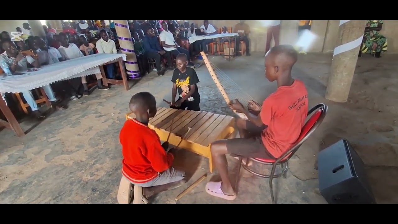 Kids from rural areas in Uganda playing xylophone during music camp at ...
