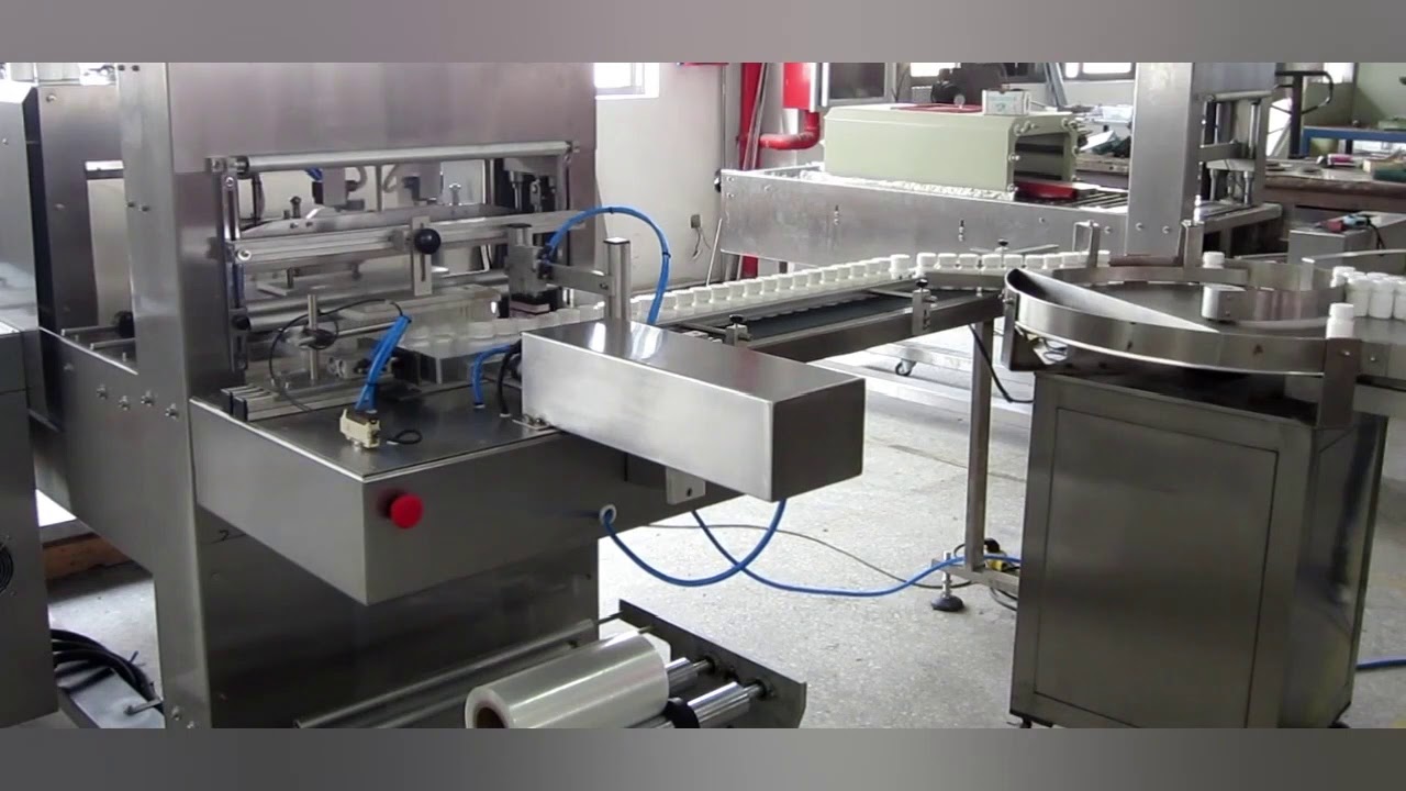automatic bundle shrink wrap machine for medicine bottle - YouTube