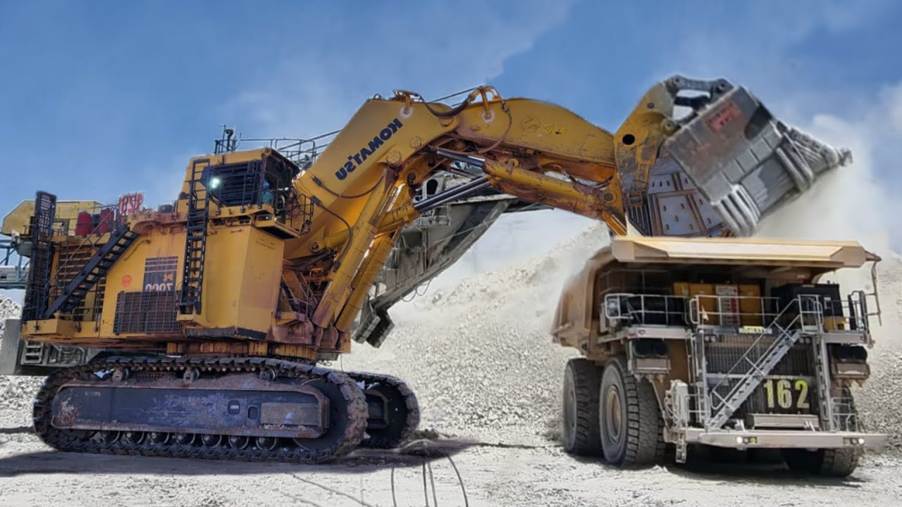 Excavator Komatsu PC 7000 Loading Dump Truck Komatsu 930E - Copper ...