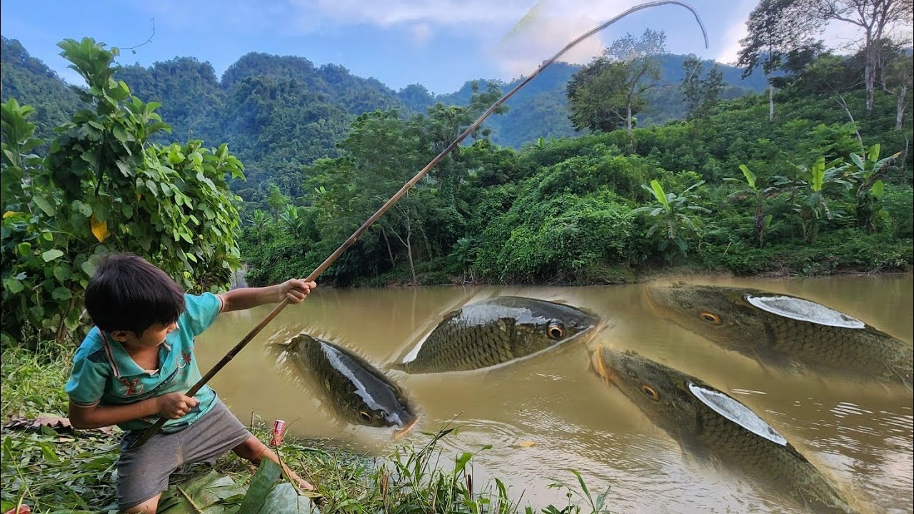 The boy and his brother set up a tent to fish in the stream. The boy ...