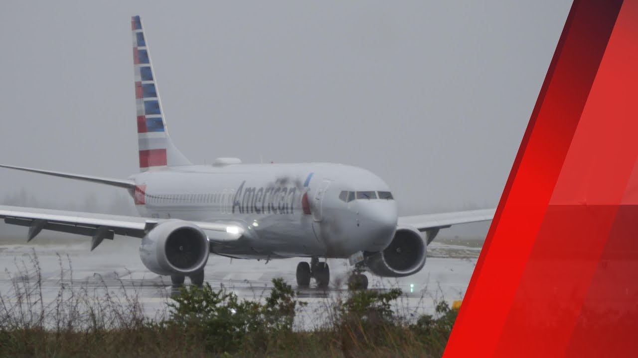 Catching American Airlines 737 MAX (in the rain) in Nassau, The Bahamas ...