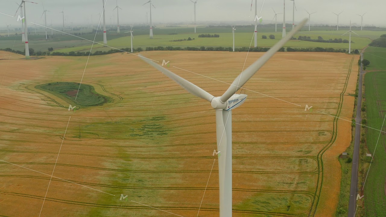 AERIAL: Wind Turbine rotating by the force of the wind and generating ...