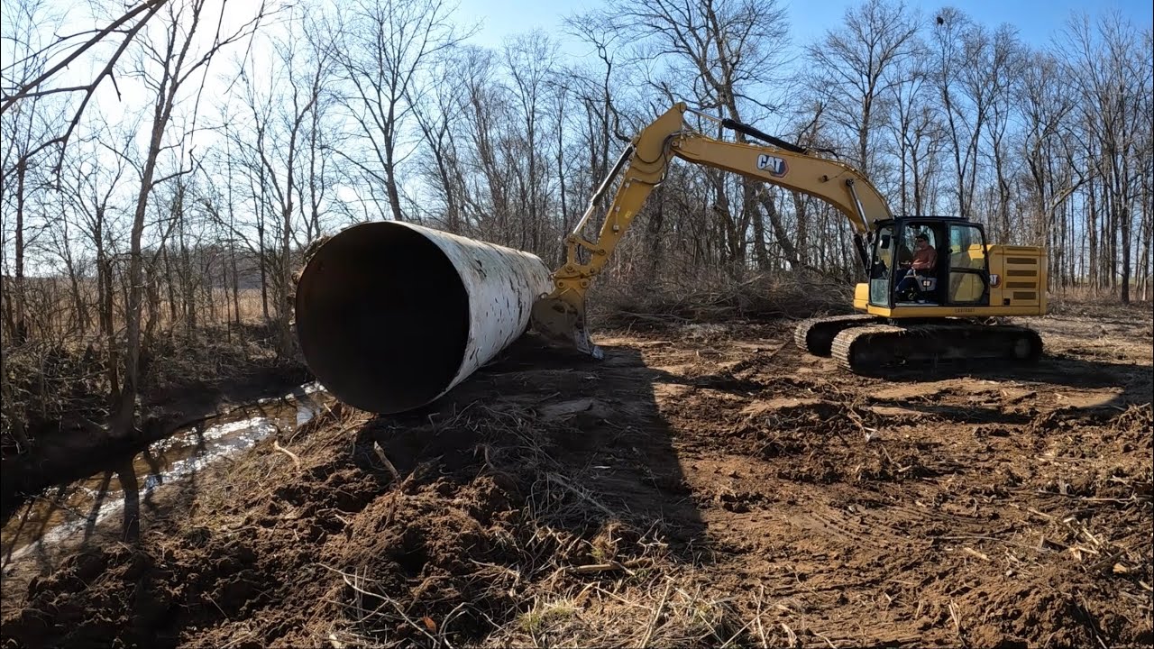 Putting in a massive new culvert and cleaning up a farm - YouTube