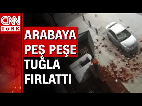 Öfkeli kadın tartıştığı adamın arabasına tuğla yağdırdı!