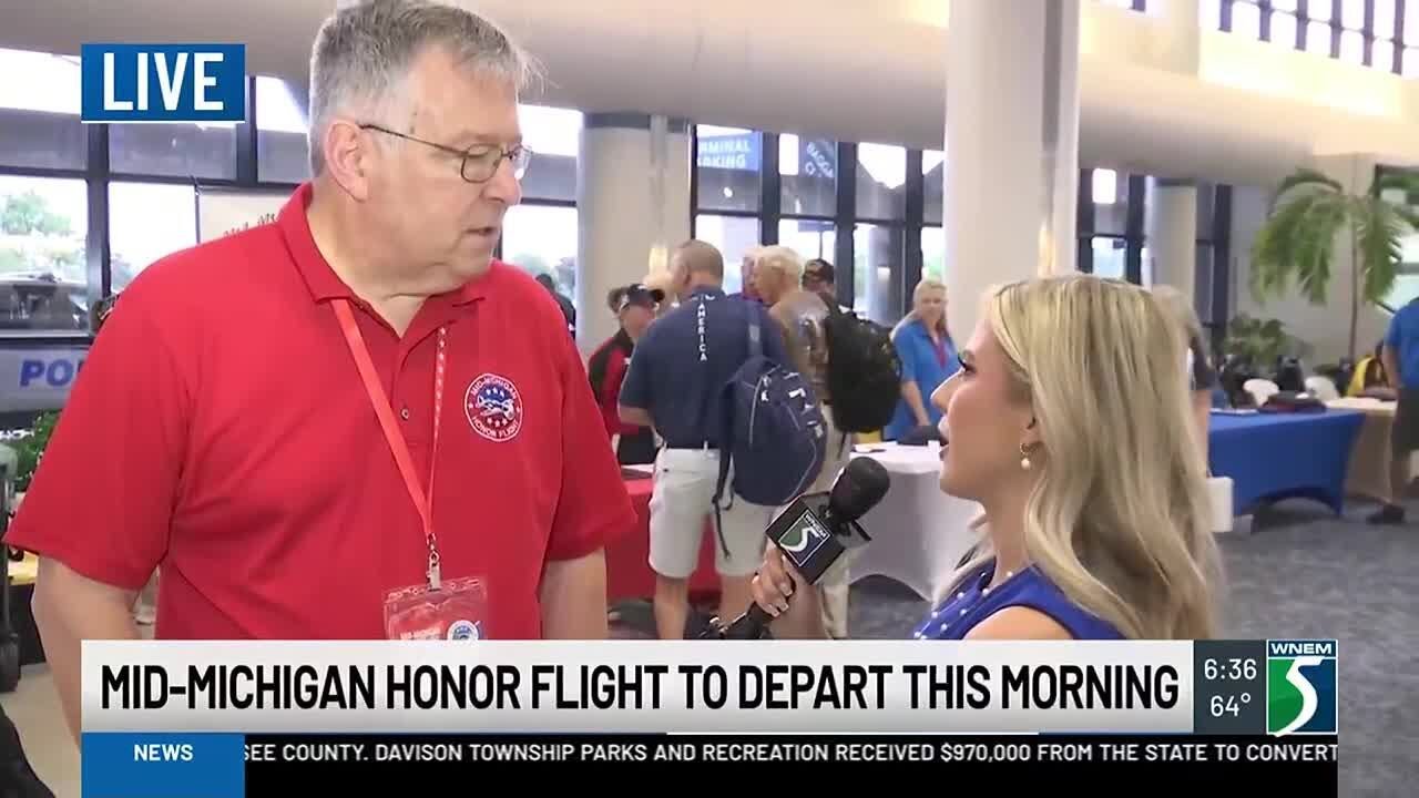 Mid Michigan Honor Flight prepares to board - YouTube