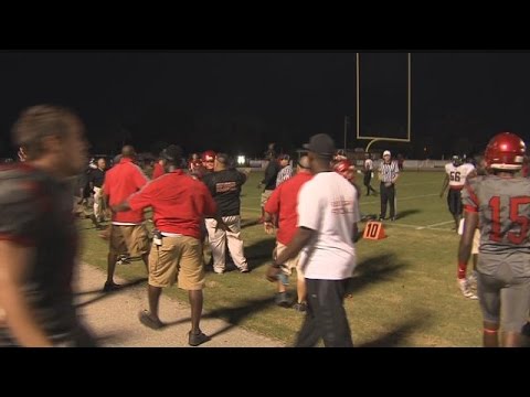 Fight breaks out at local high school football game - YouTube