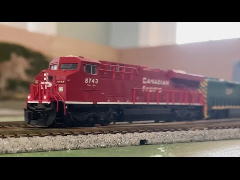 CP 8743 towing O&K 3671 for repairs after hitting a car in Kennyville (N Scale Wensday) - YouTube