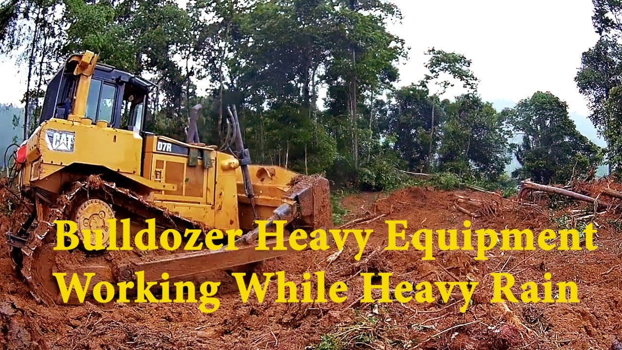 Heavy Equipment Bulldozers Work During Heavy Rains are very extreme ...