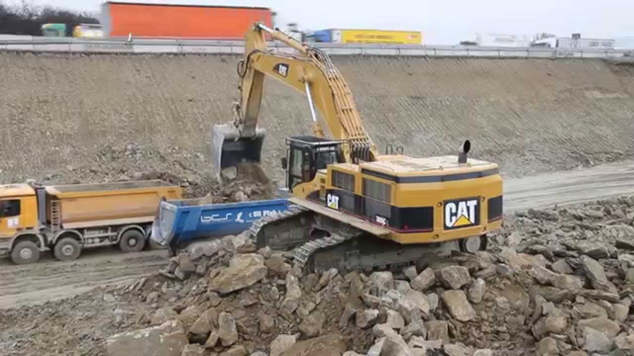 Caterpillar CAT 385C L loading trucks - YouTube
