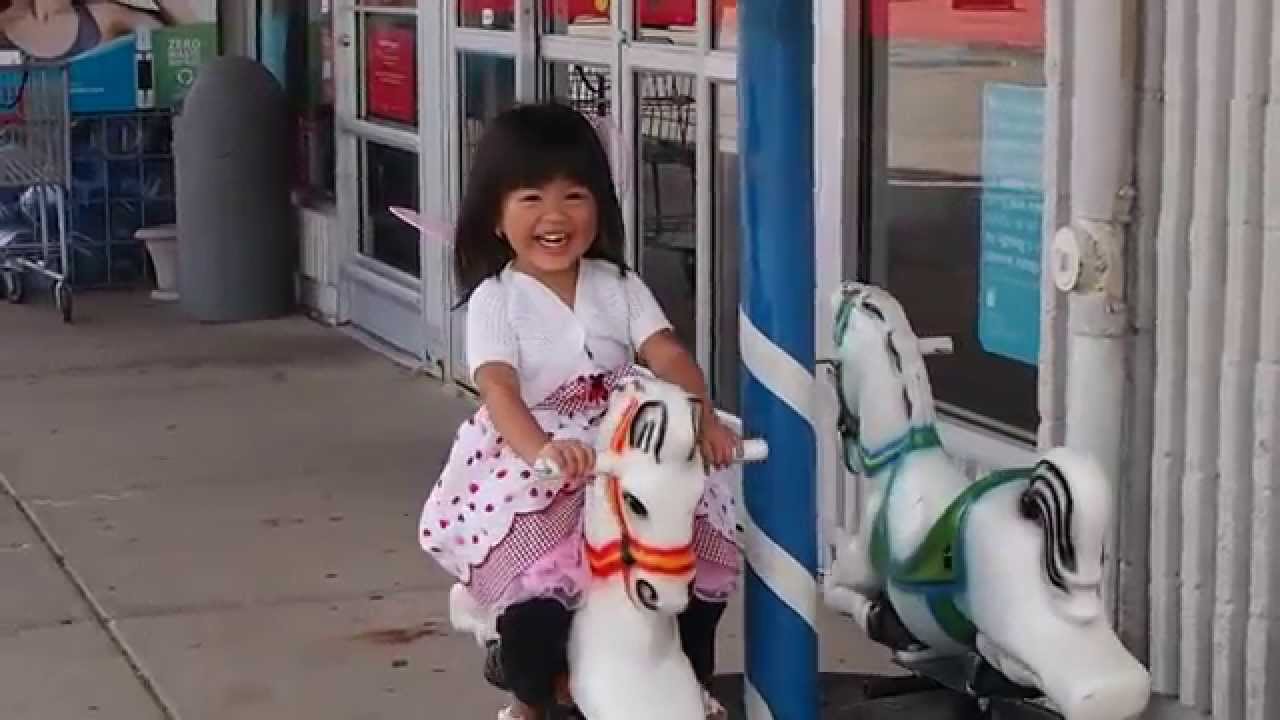 Lily riding a mini marry-go-round horse at K-Mart. - YouTube