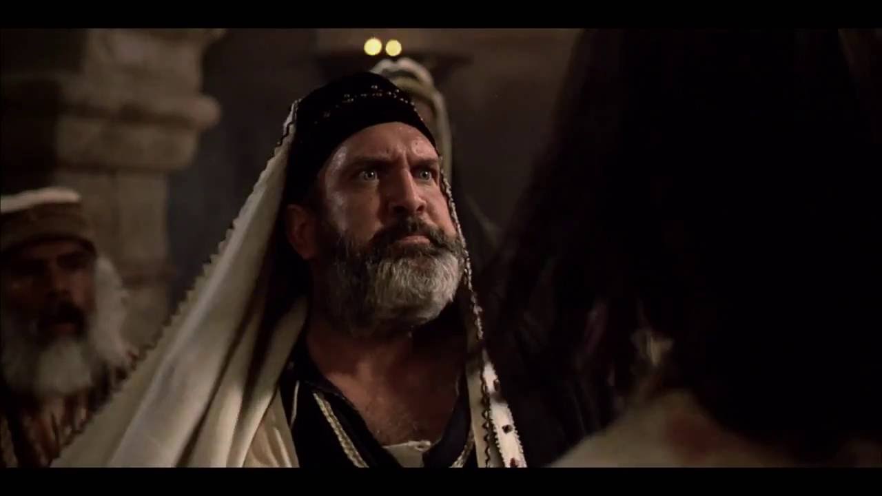 Jesus being tried by Caiaphas, smitten, and spat upon - YouTube