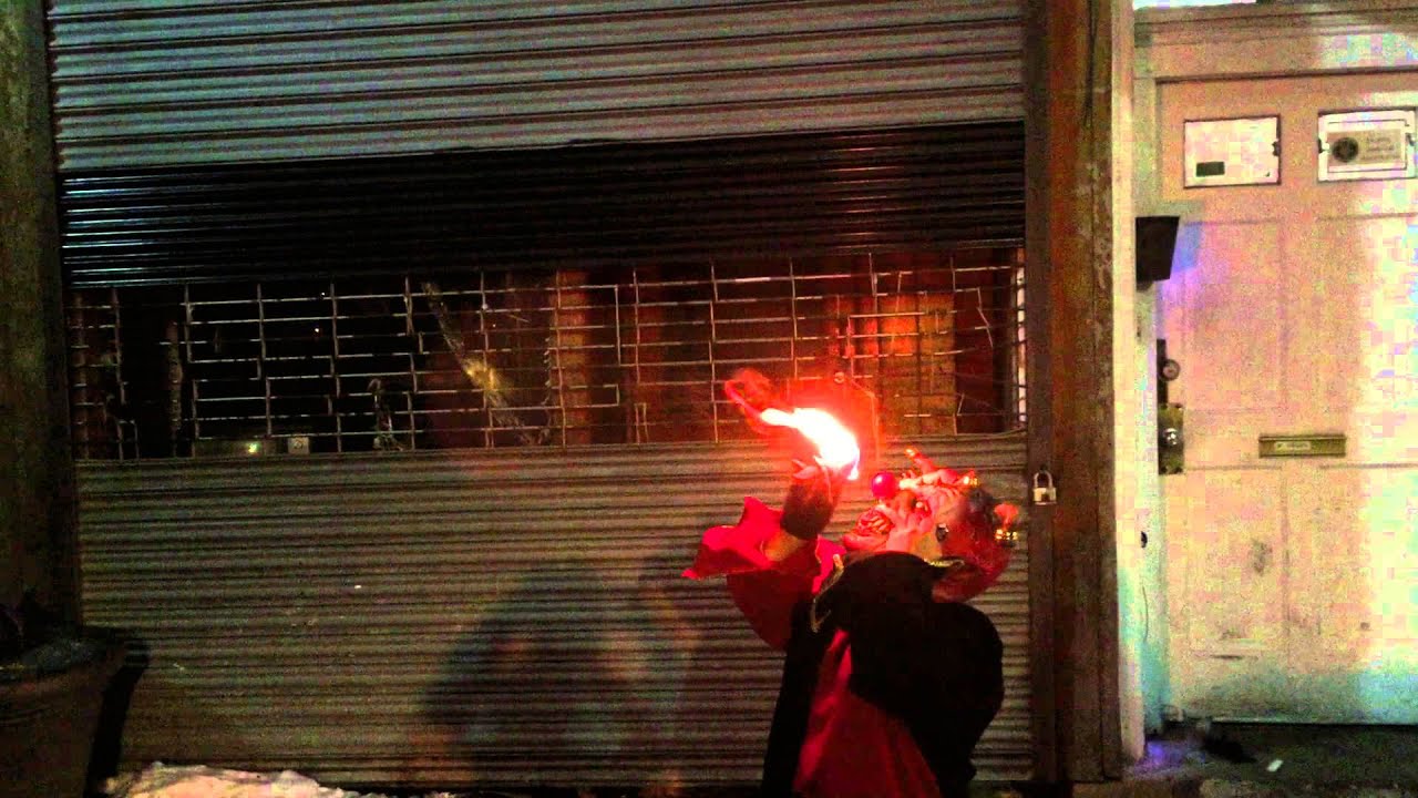 Evil fire-breathing clown lights his hand on fire - YouTube