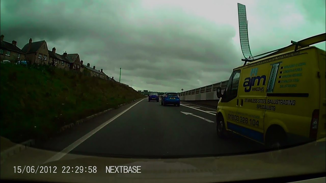 Insecure load from van hits car - YouTube