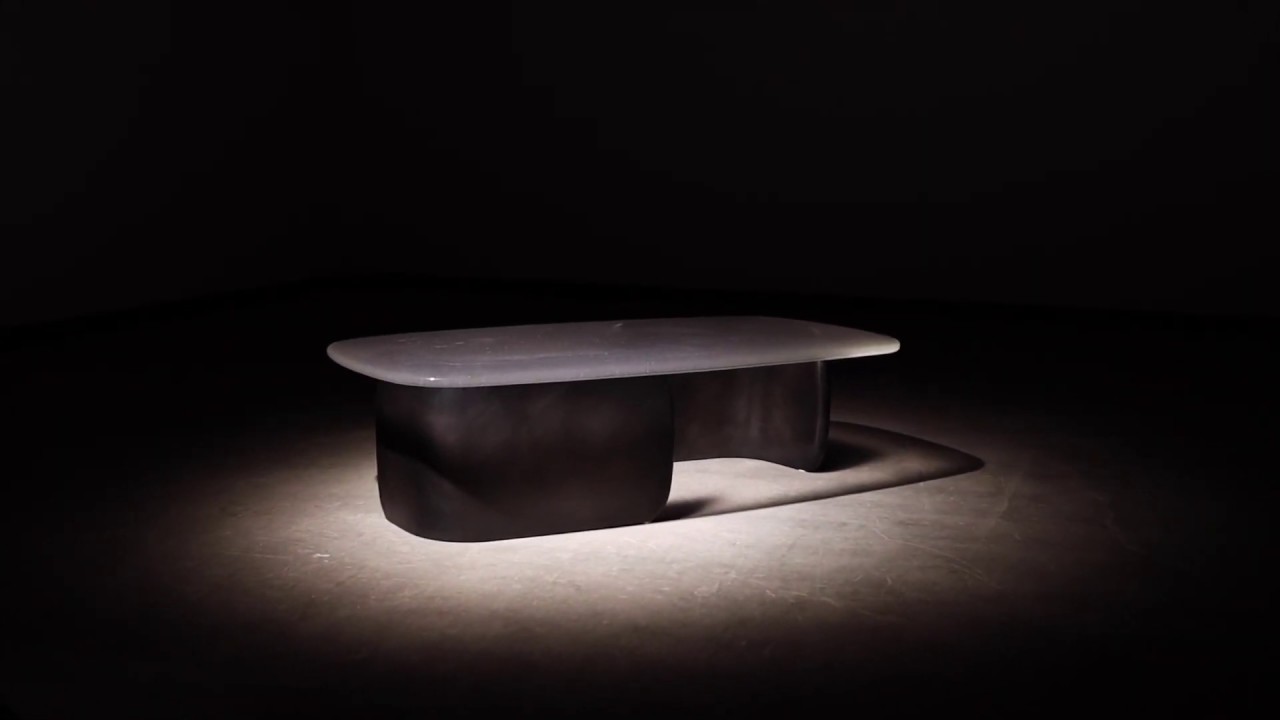 John Pomp designs hand-poured glass Tidal table to look like a puddle ...