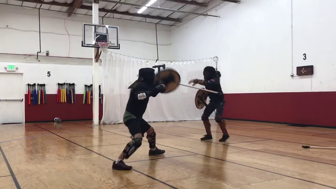 Spear and shield fighting - YouTube