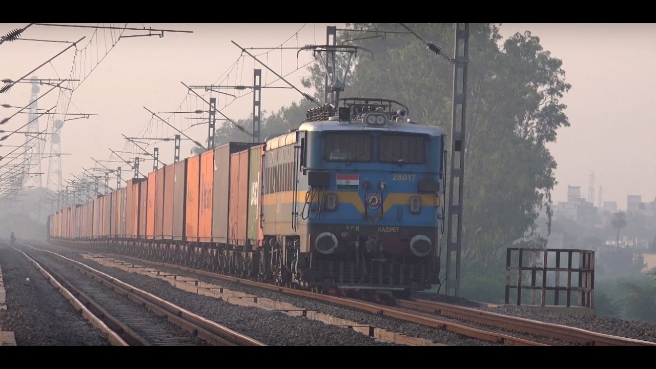Early Morning Sunlit, Colourful High Speed Container Train In Navsari ...