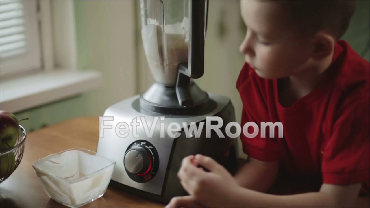 A small boy switching on a blender and watching it - YouTube