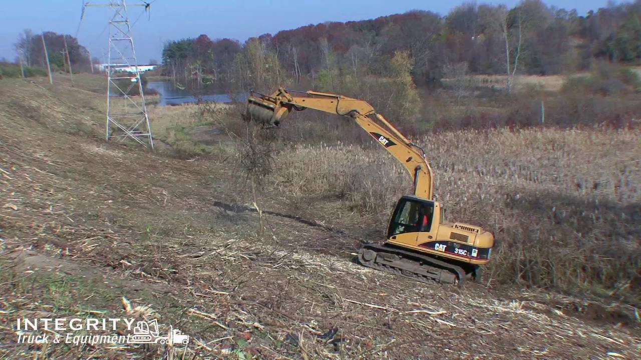 Brown Brontosaurus on Cat 315CL - YouTube