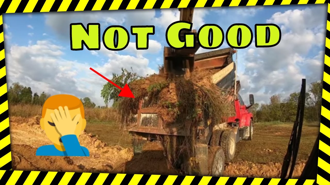 Digging out for a retaining wall with John Deere excavator and leveling ...
