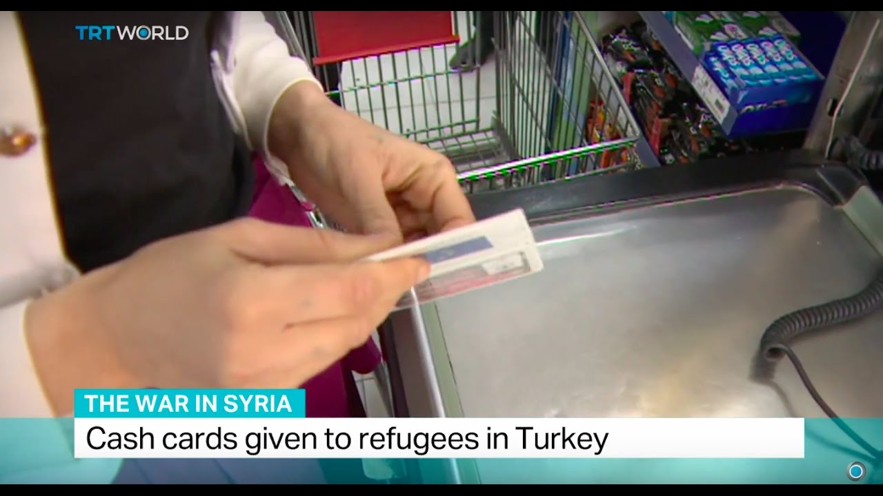 The War In Syria: Cash cards given to refugees in Turkey - YouTube