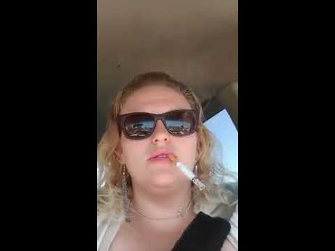 Dangling cigarette in the car, windows up