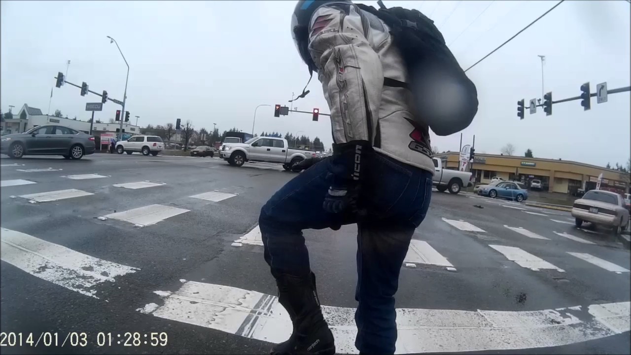 Motorcyclist dancing in the rain - YouTube