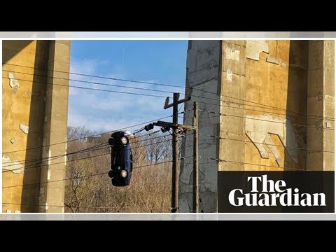 Is it a prop? Is it a prank? Mystery car hanging from bridge perplexes ...