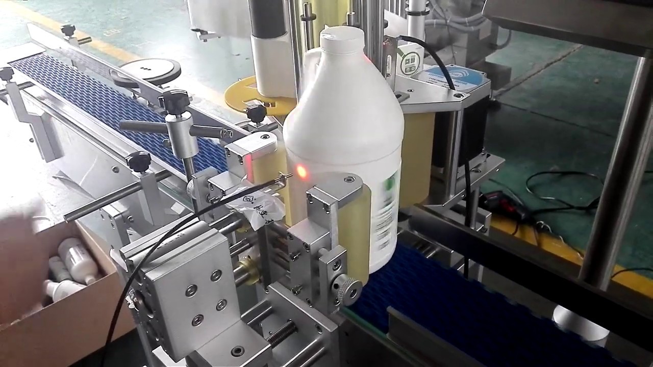 Fix position labeling machine for bottle with handle - YouTube