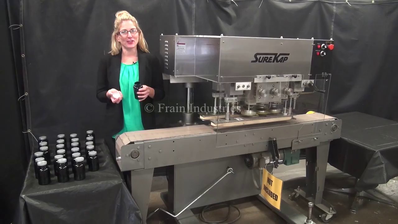 SureKap Semi-Auto Inline Roll Over Conveyor Capper Demonstration - YouTube