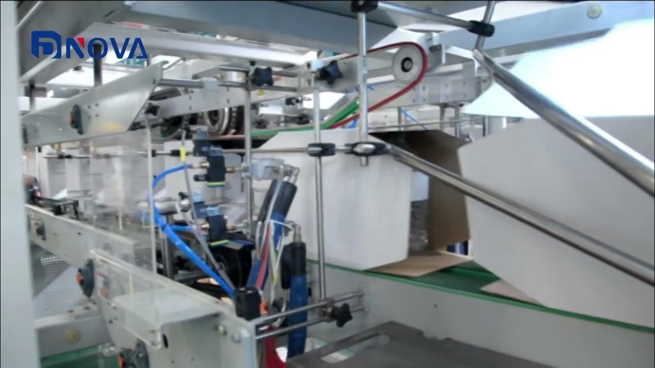 Wrap around case packer-automatic insert inner paper (cardboard ) to protect bottles - YouTube