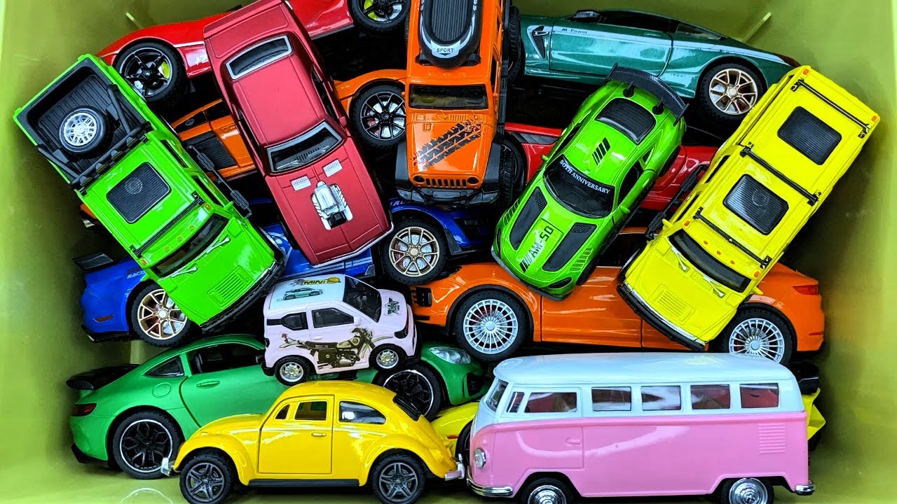 Box full of various miniature cars Peugeot, Volvo, Renault, Hyundai ...