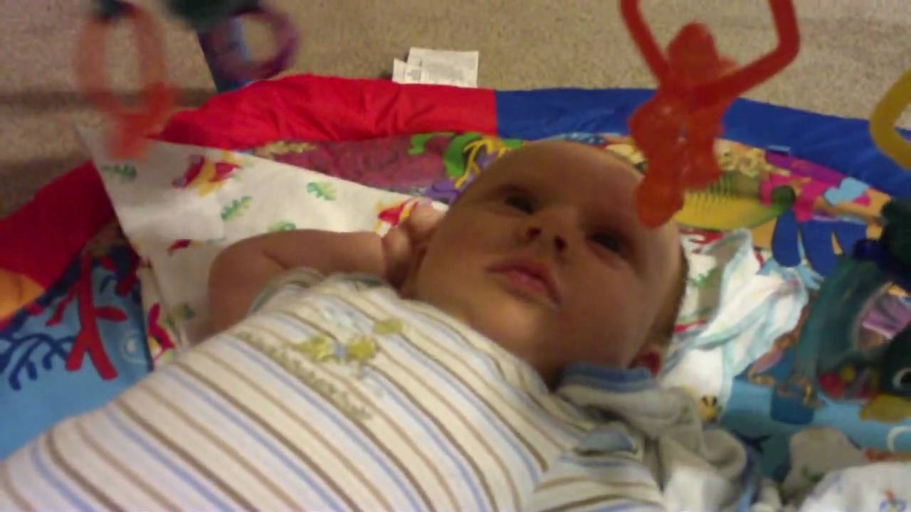 Wiggling around on play mat, day before he's 2 months old! - YouTube