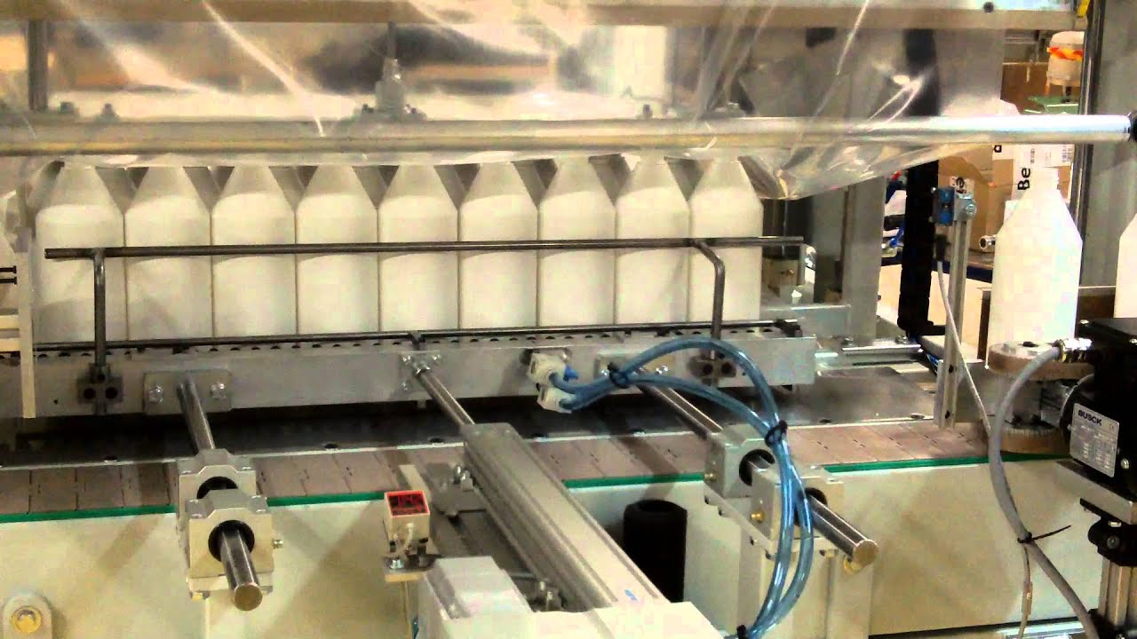 Pakkemaskine der pakker en 1 liters flaske - YouTube