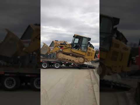 B&K Excavating offloading a CAT 953K track loader on a Felling FT-50-3 LP with Air Ramps - YouTube