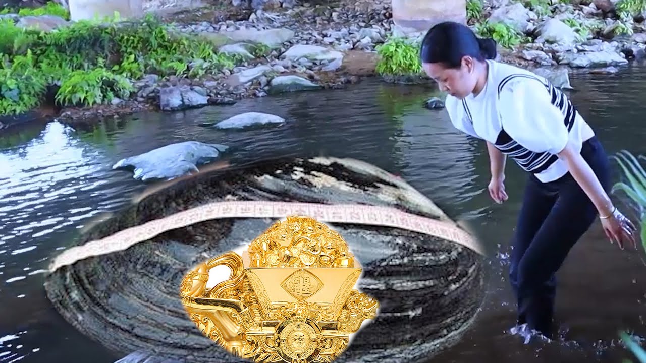 The girl picked up a hundred year dormant clam shell, which was filled ...