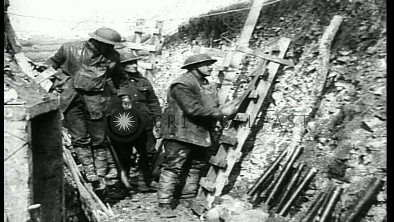 Australian troops advance and soldiers fix scaling ladders in a trench ...