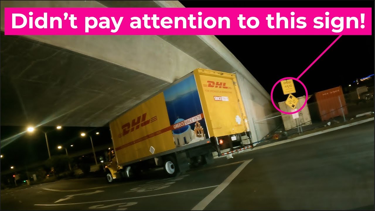 Truck gets stuck under freeway overpass! - YouTube