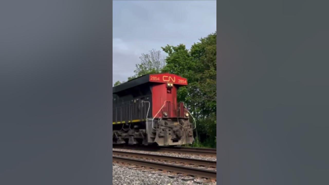 CN #2854 and CP #8712 running long hood forward together on NS 238 - YouTube