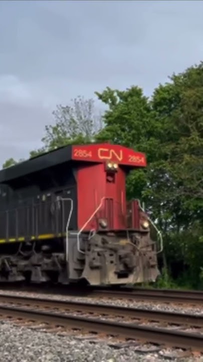 CN #2854 and CP #8712 running long hood forward together on NS 238 - YouTube