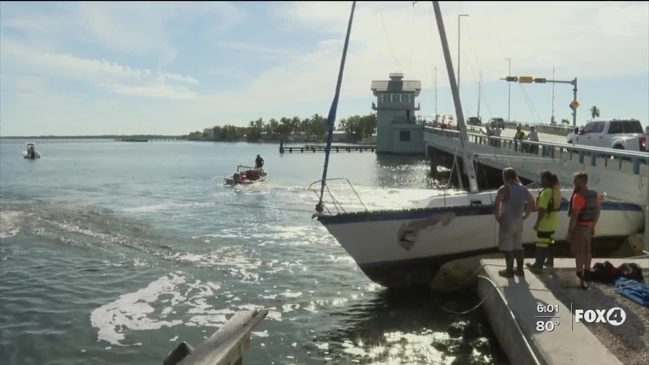 Boat still stuck on the Matlacha Pass Bridge, despite attempts to pull ...