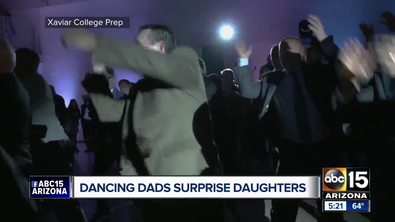 Dancing dads surprise daughters at Xavier College Prep dance - YouTube