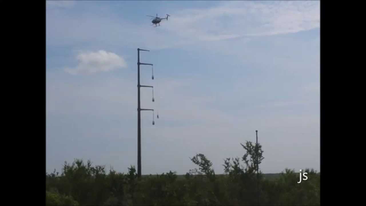 Guy hangs 300 feet off ground from flying helicopter - Craziest thing I ...