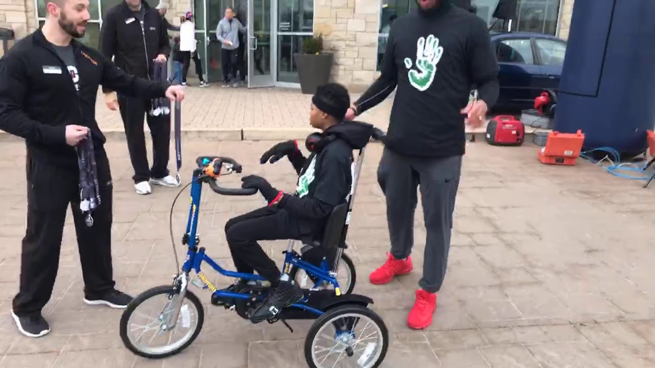 Adorable little boy finishes his first 5K race with handicap bike ...