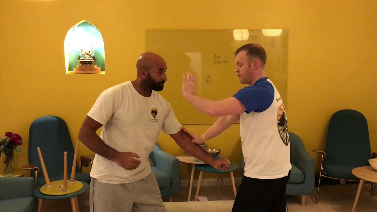 Gum-Sau - blocking low straight punches and upper cuts, as well as ...