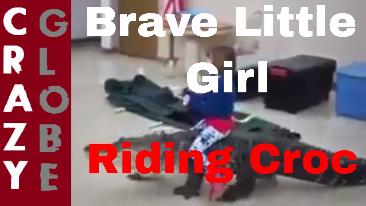 little girl riding alligator - YouTube