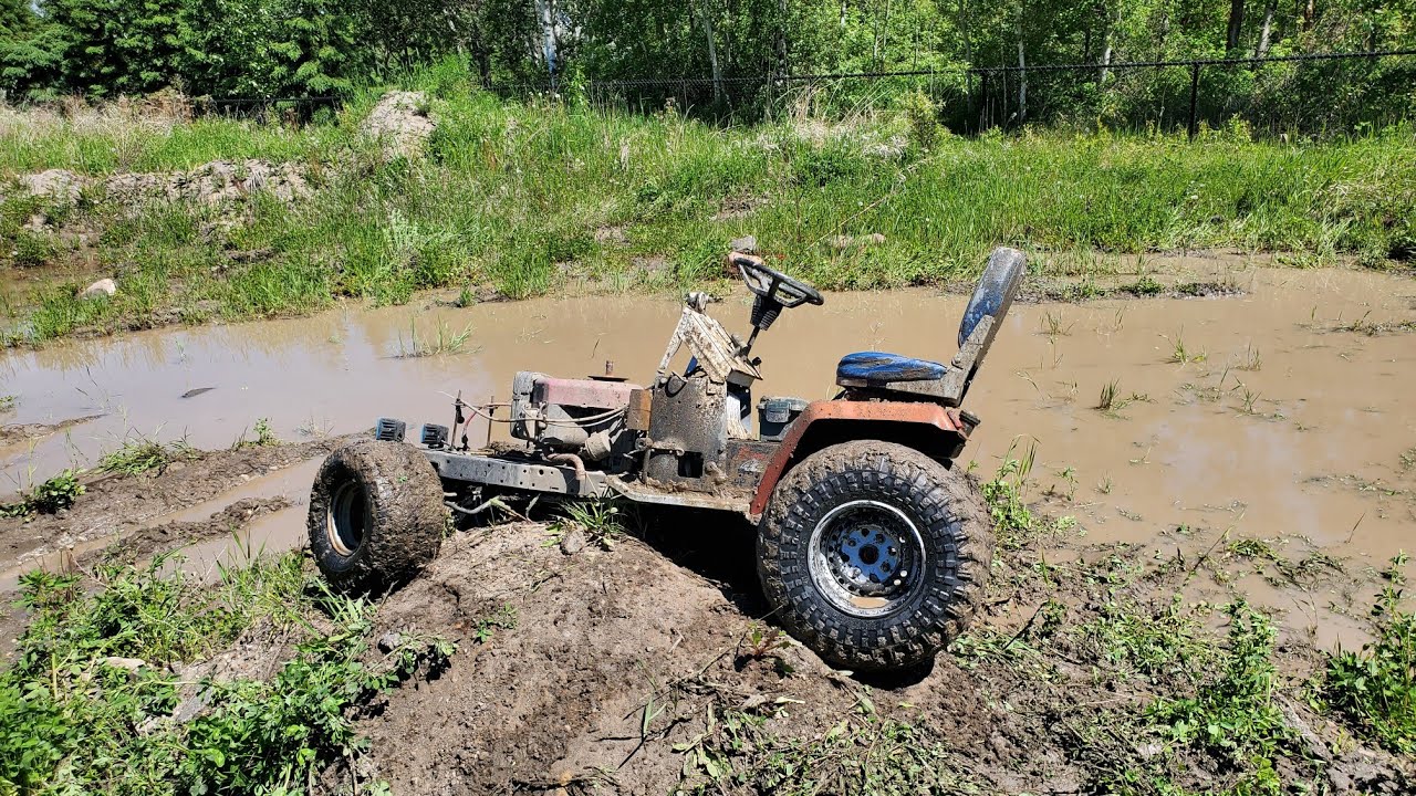 Back yard mud mower romp 2020 with kids - YouTube