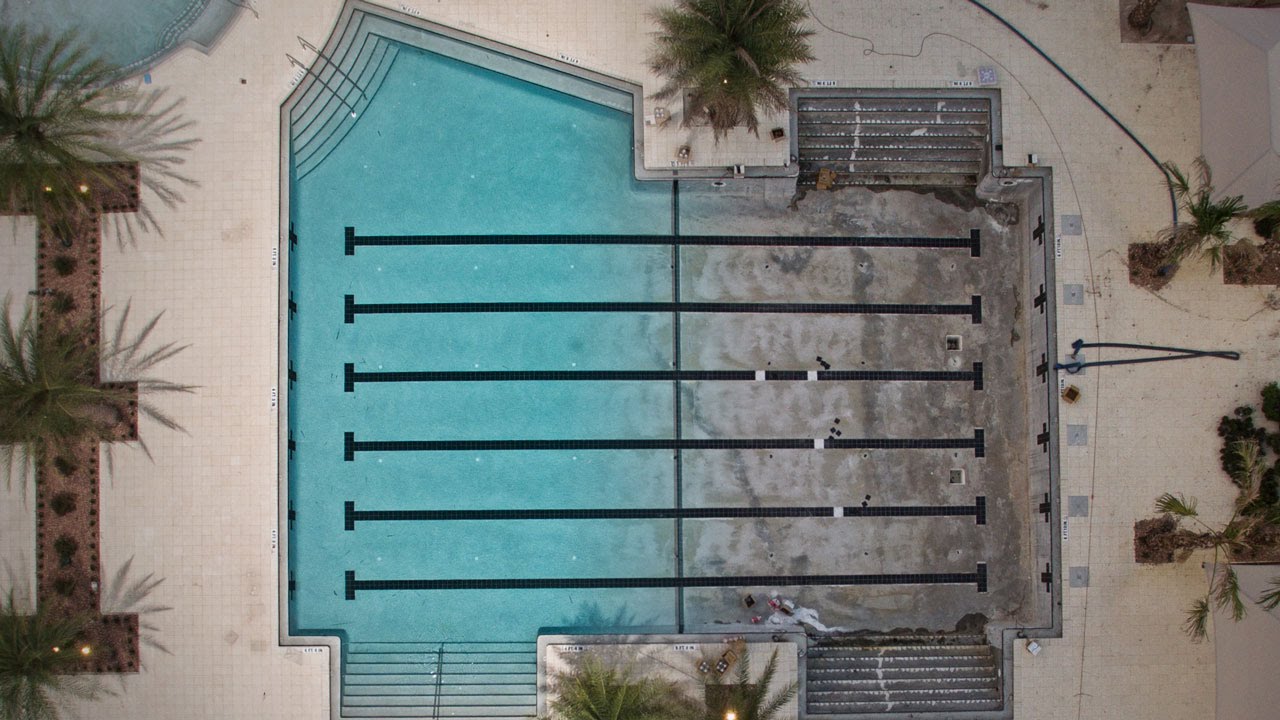 How an Olympic Style Swimming Pool Is Properly Surfaced - YouTube