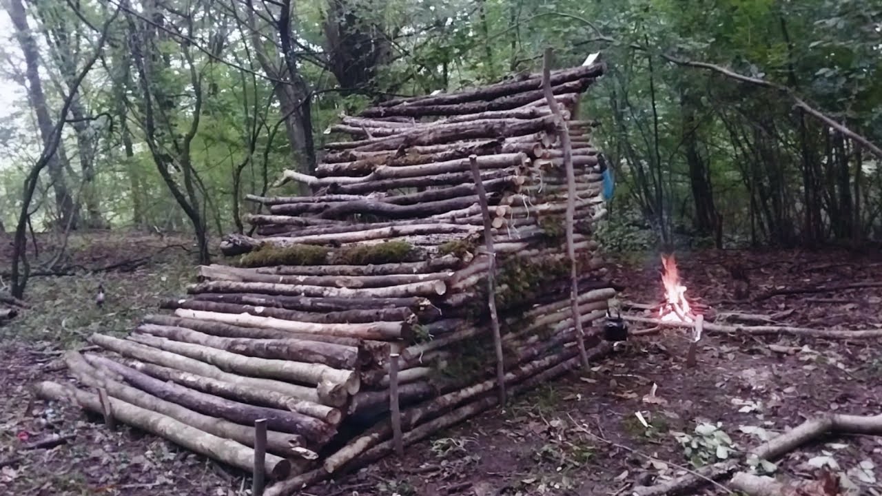 Construction of survival shelter | Bushcraft wooden hut , grass wall ...