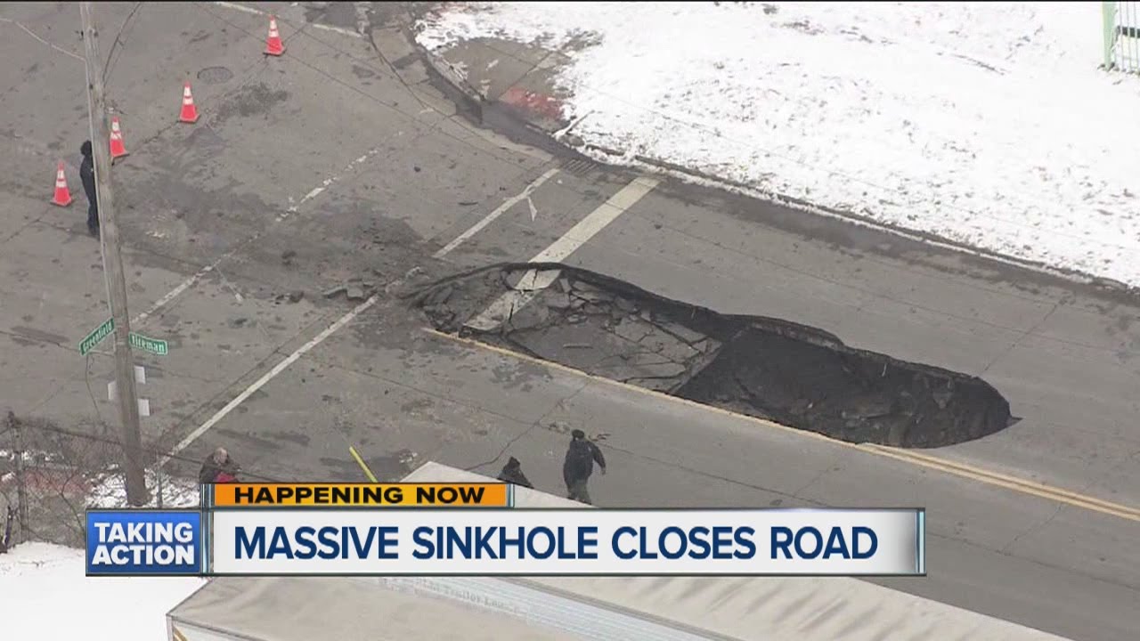 Massive sinkhole closes road - YouTube