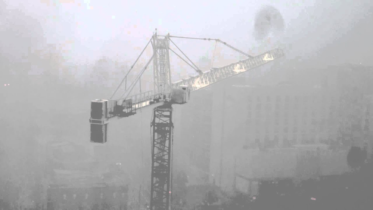 Crane blowing in a storm next to the CNN Center - YouTube